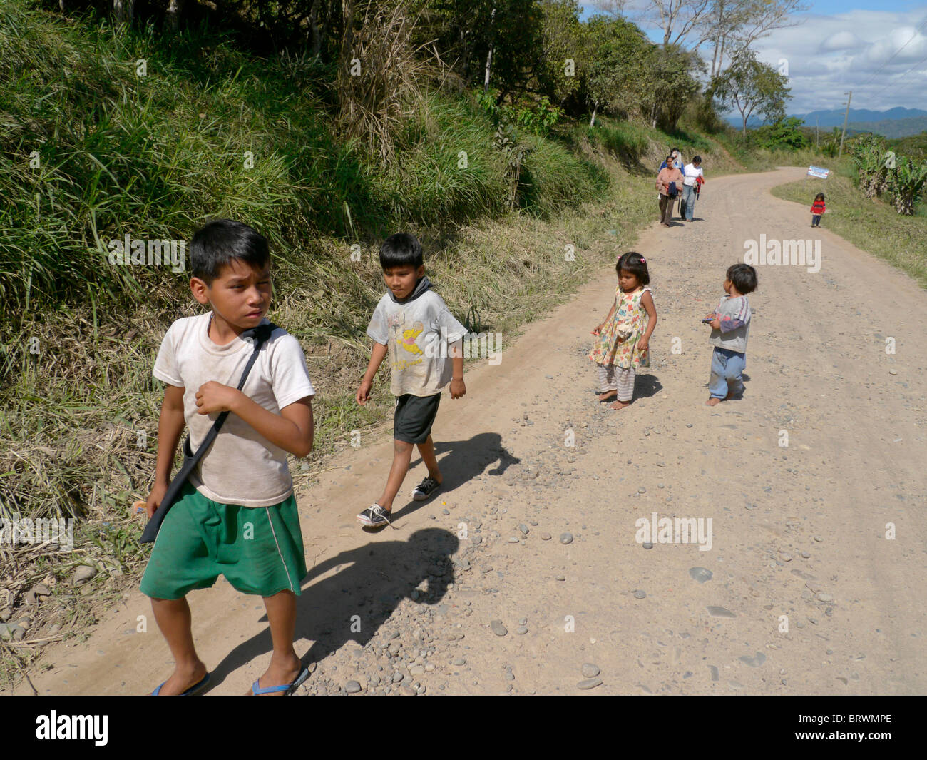 BOLIVIA Children walking on a road in Alto Beni. photograph by Sean ...