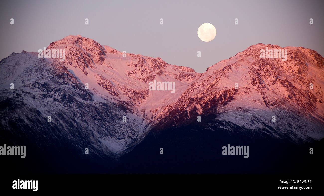 Full moon over snow capped hi-res stock photography and images - Alamy