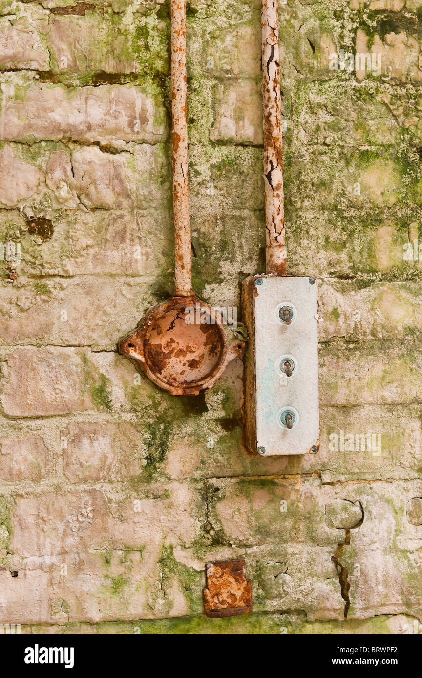 Dereliction of urban landscape rundown single rusty electrical light ...
