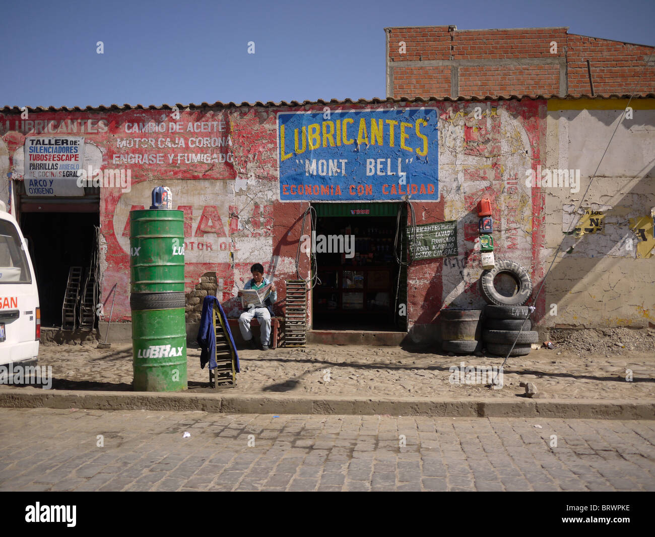 BOLIVIA Street scenes in La Paz. Car servicer, El Alto. photograph by ...