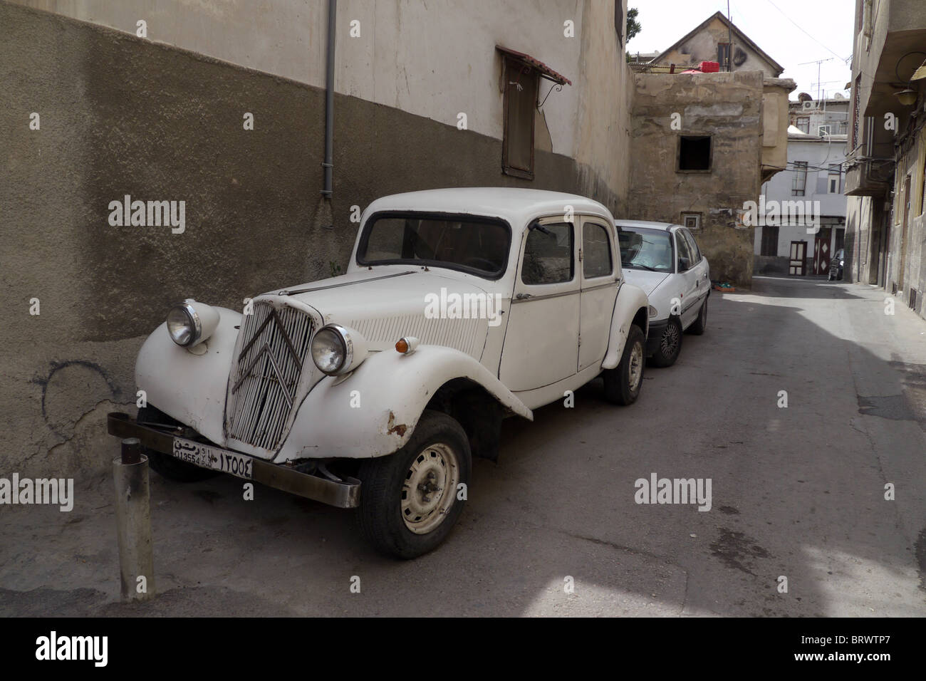 SYRIA Street scene in the old city of Damascus. Old Citroen car ...