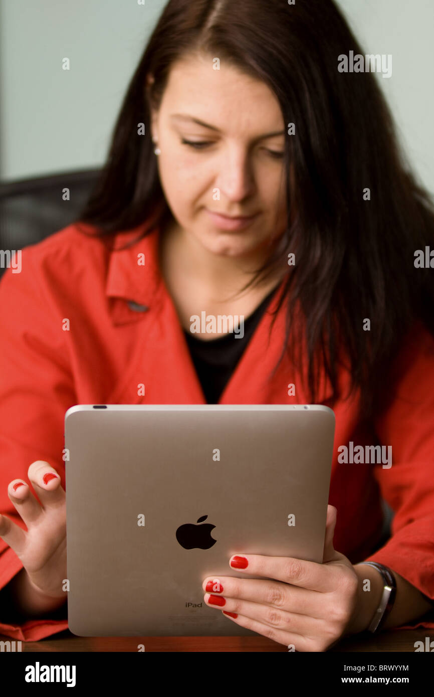 Young woman using the Apple iPad Stock Photo - Alamy