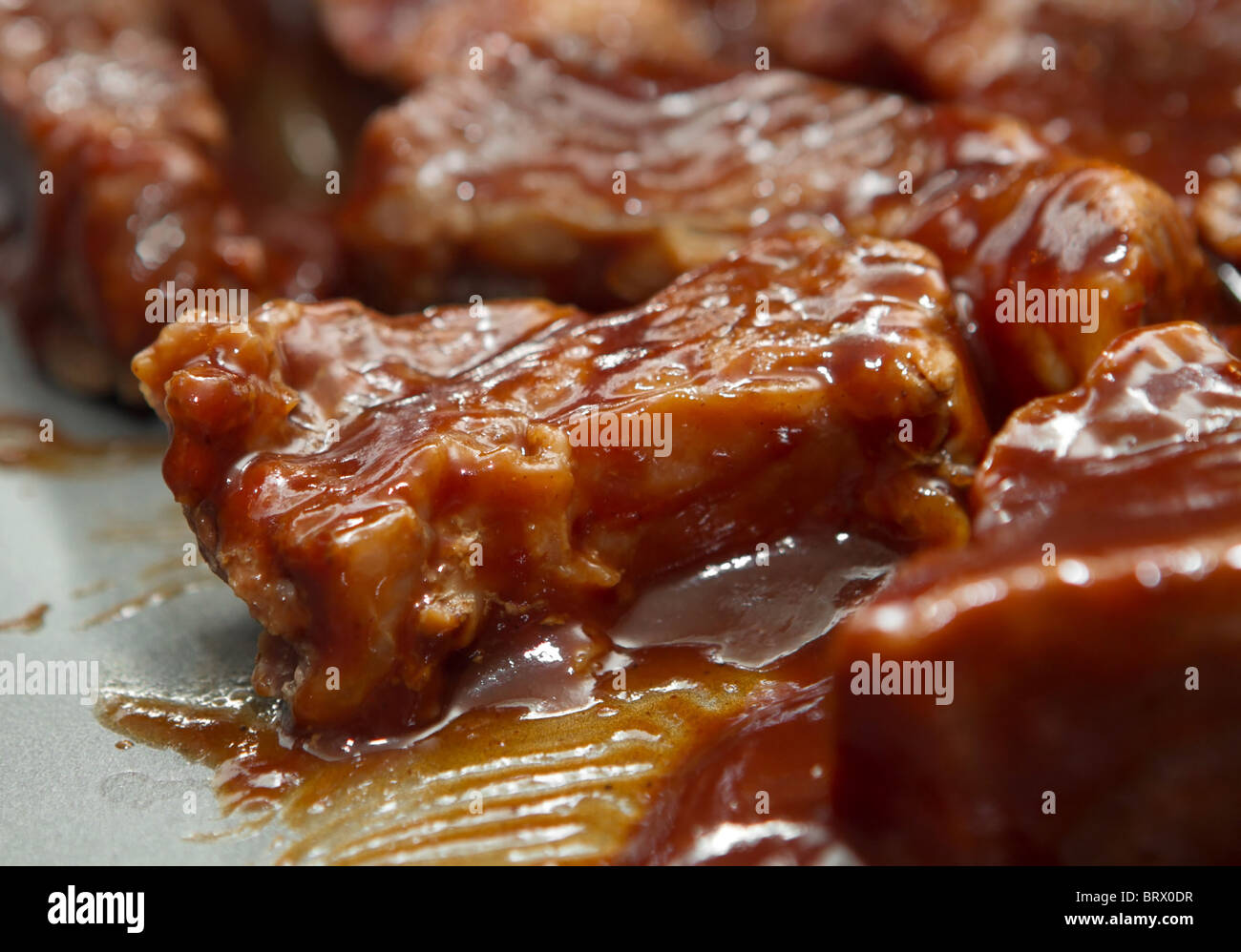 closeup of a tray of uncooked spare ribs before grilling Stock Photo ...