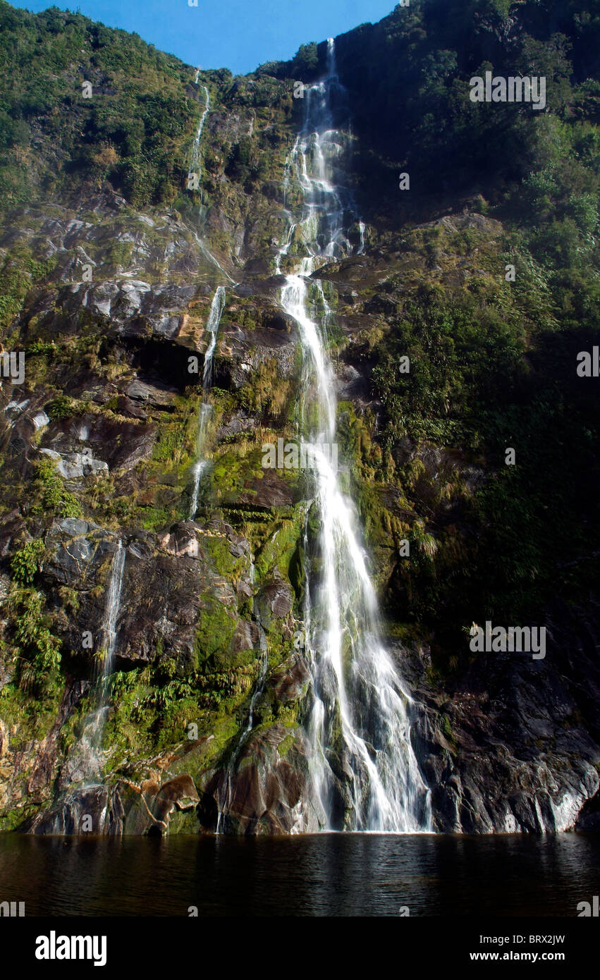 Long, thin waterfall cascades down the mountainside Stock Photo - Alamy
