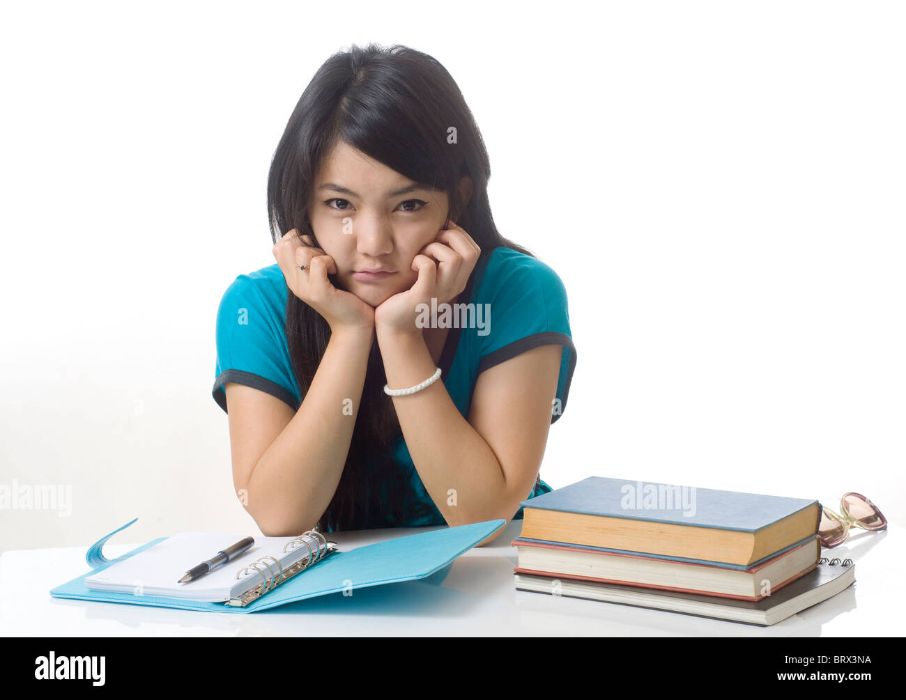 Young attractive female Asian student doing homework Stock Photo - Alamy