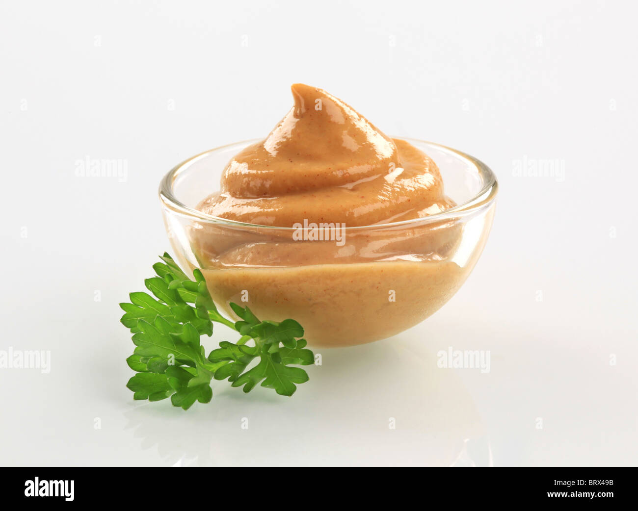 Swirl of spicy mustard in a bowl Stock Photo - Alamy
