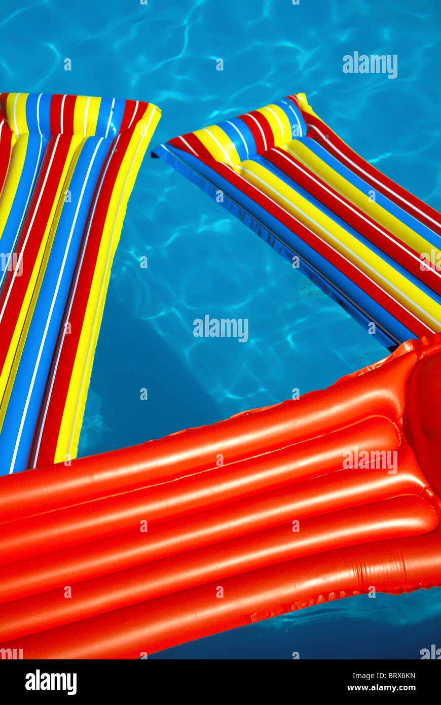 summer vacation lilos floating in swimming pool Stock Photo - Alamy