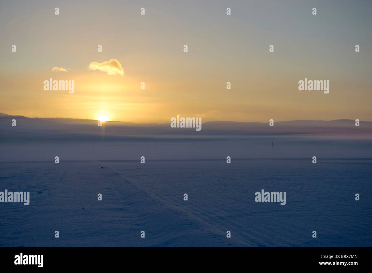 Sunrise Over Snow Fields Stock Photo - Alamy