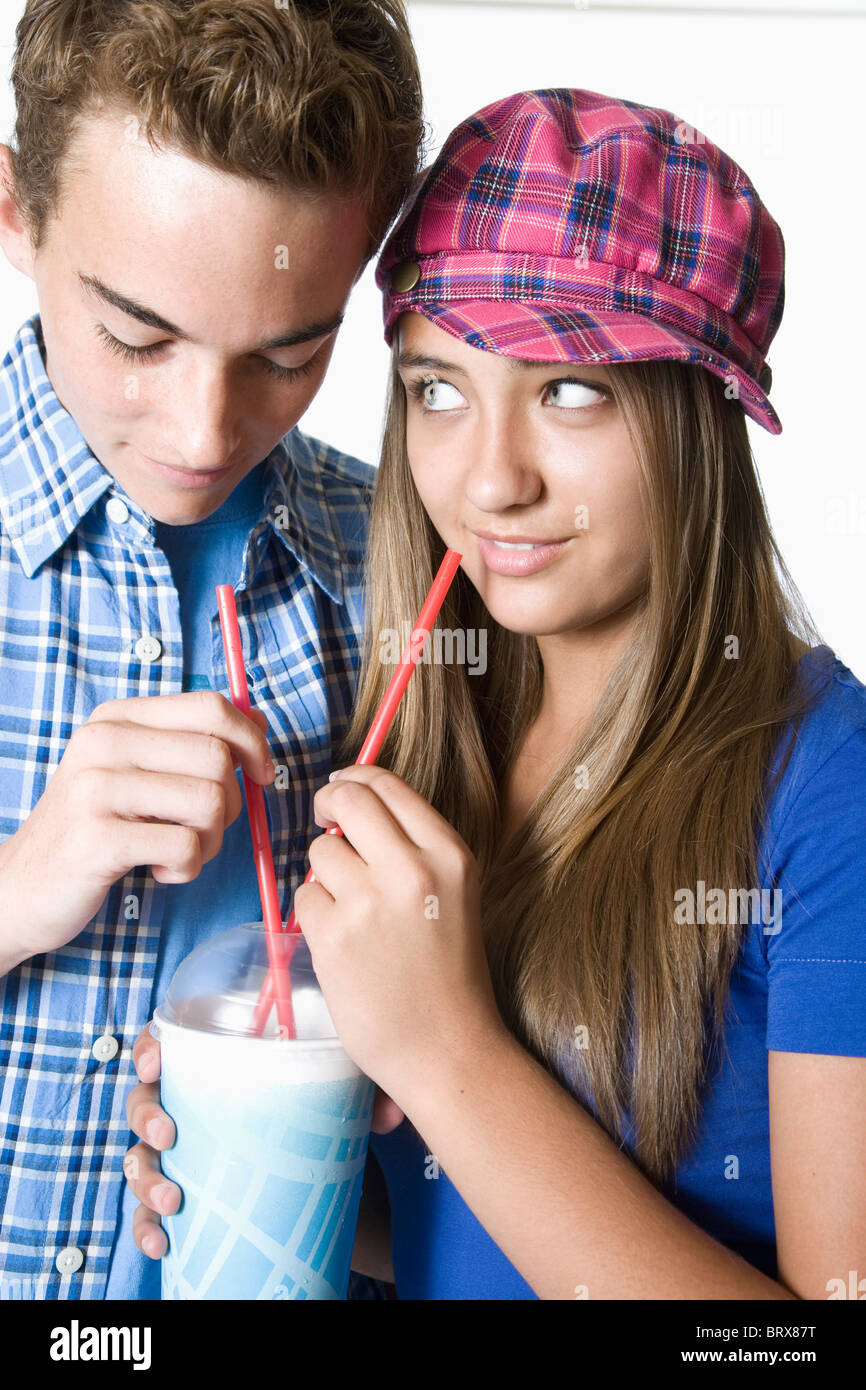 Teenage couple sharing milkshake hi-res stock photography and images ...