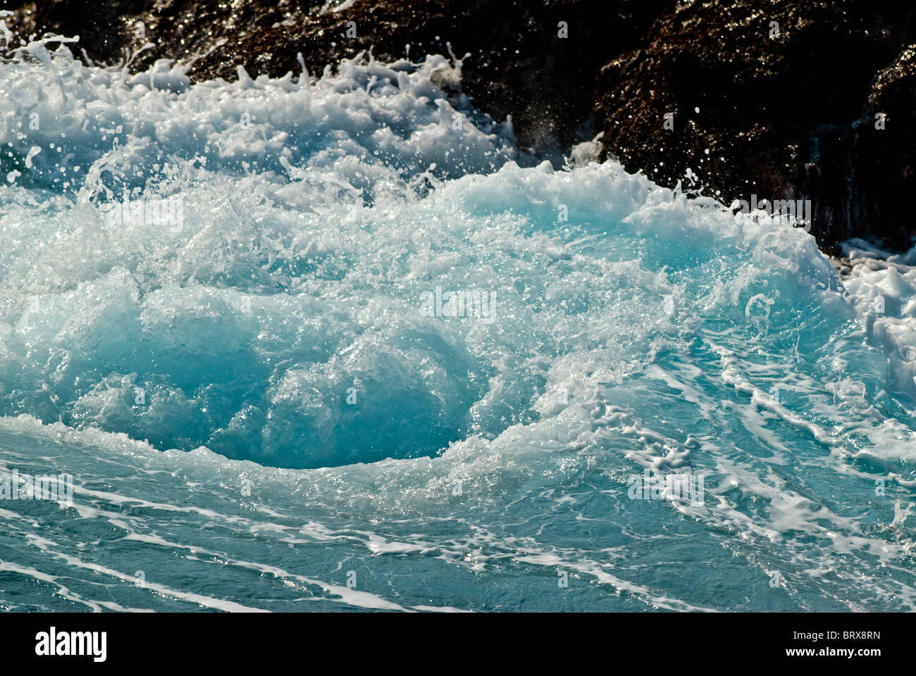 Water Splashing Against Rocks Stock Photo - Alamy