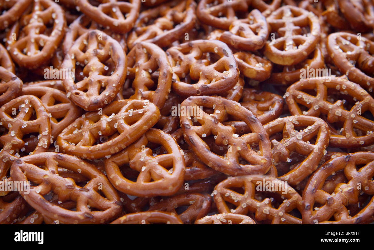 many pretzels in a pile closeup food background Stock Photo - Alamy