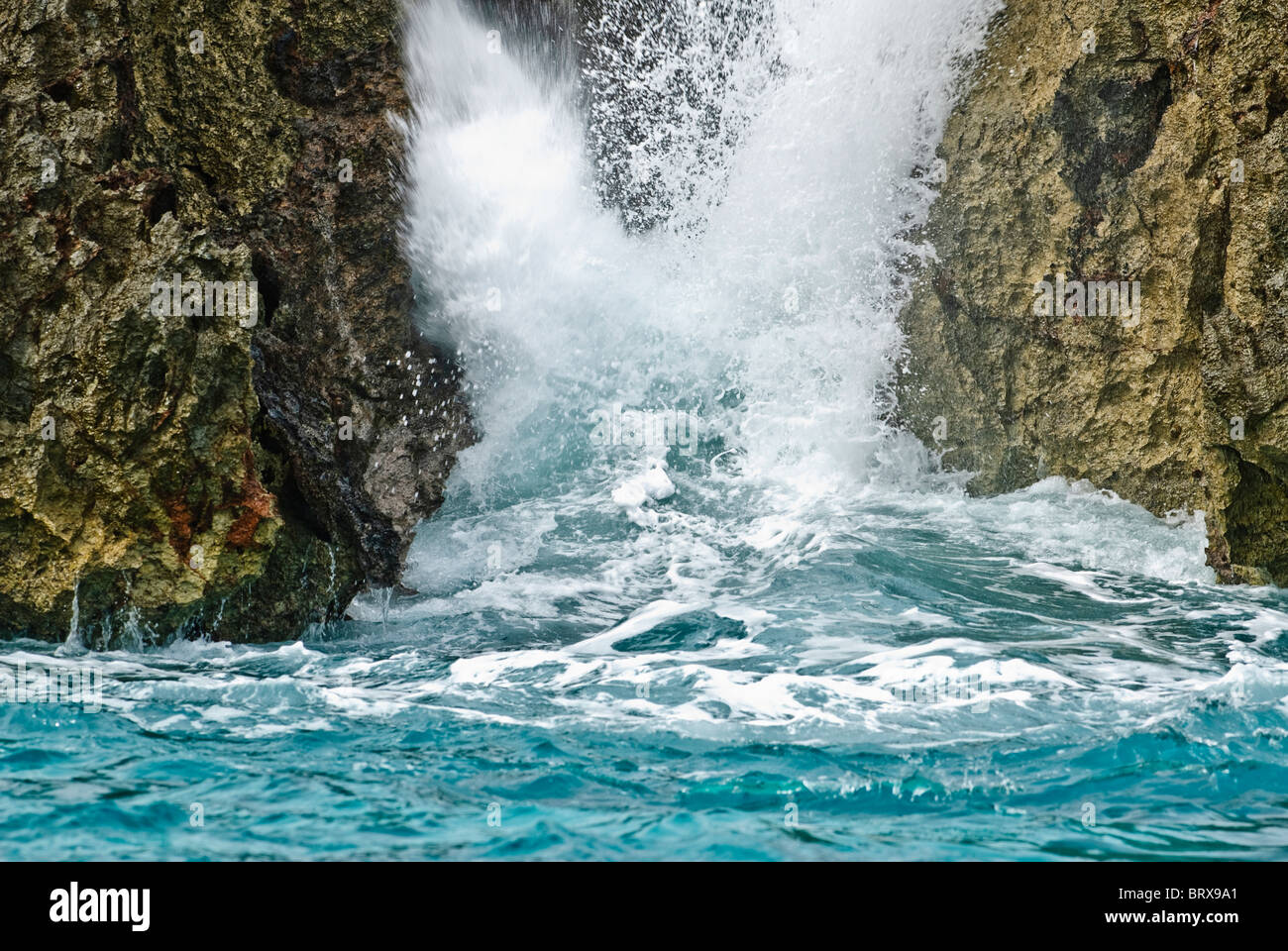 Wave Splashing Against Rocks Stock Photo - Alamy