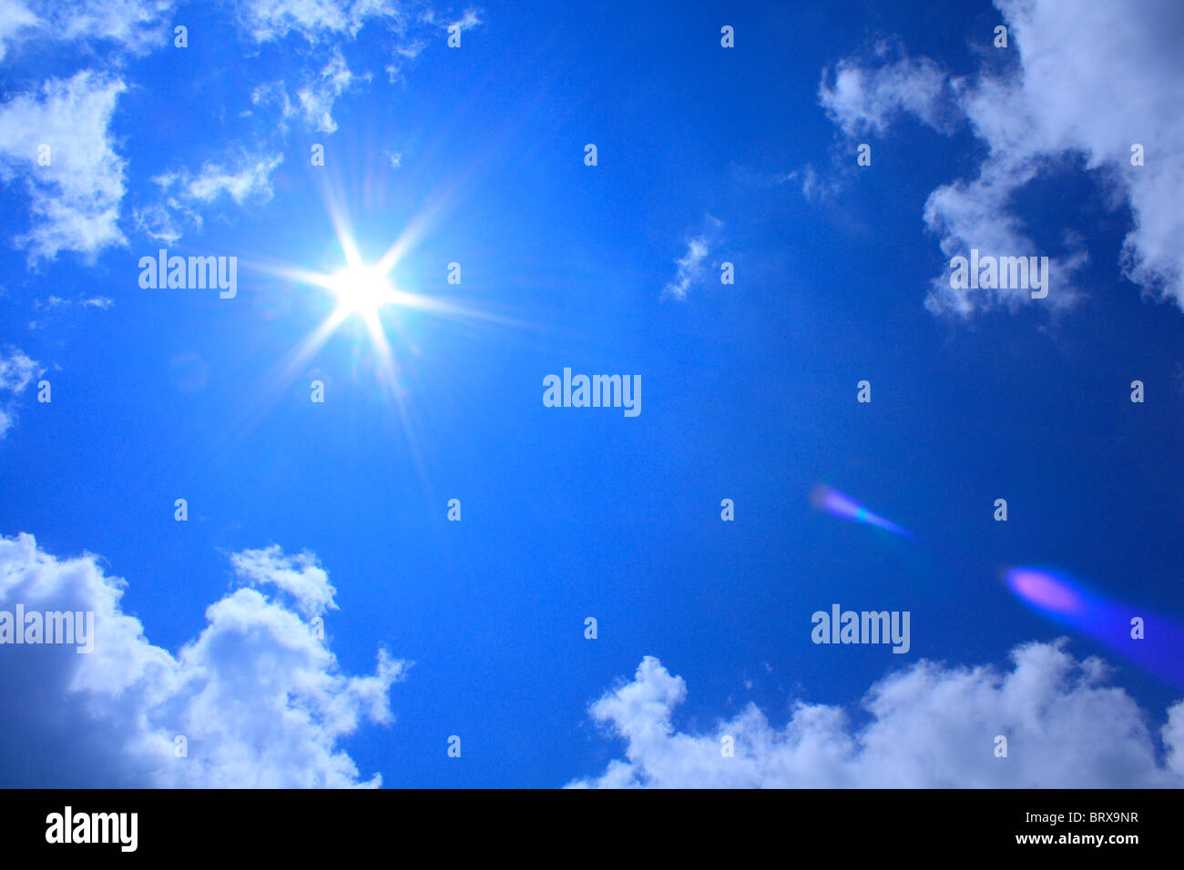 Sun in Blue Sky Stock Photo - Alamy