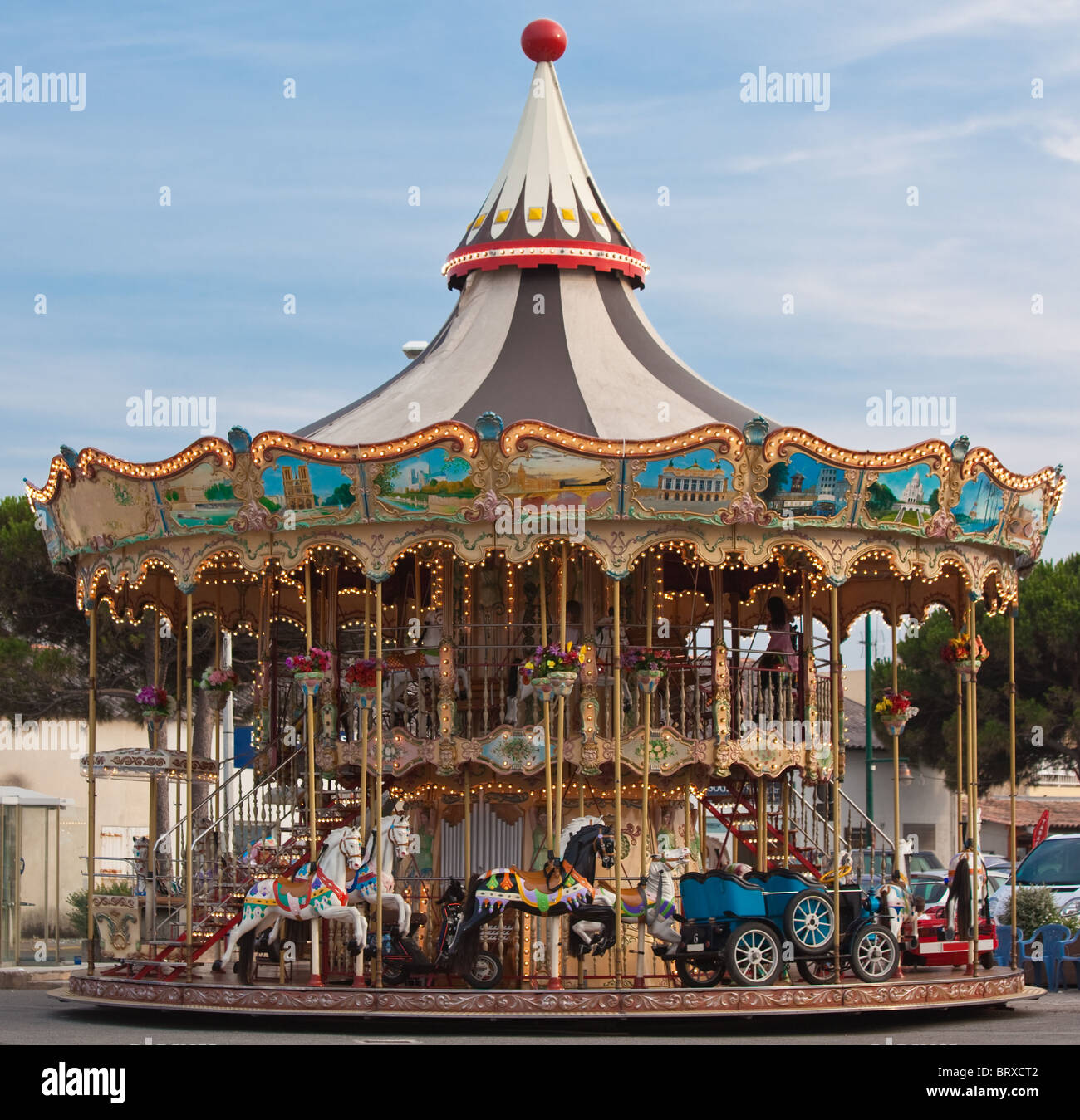 color carousel with horses and cars Stock Photo - Alamy