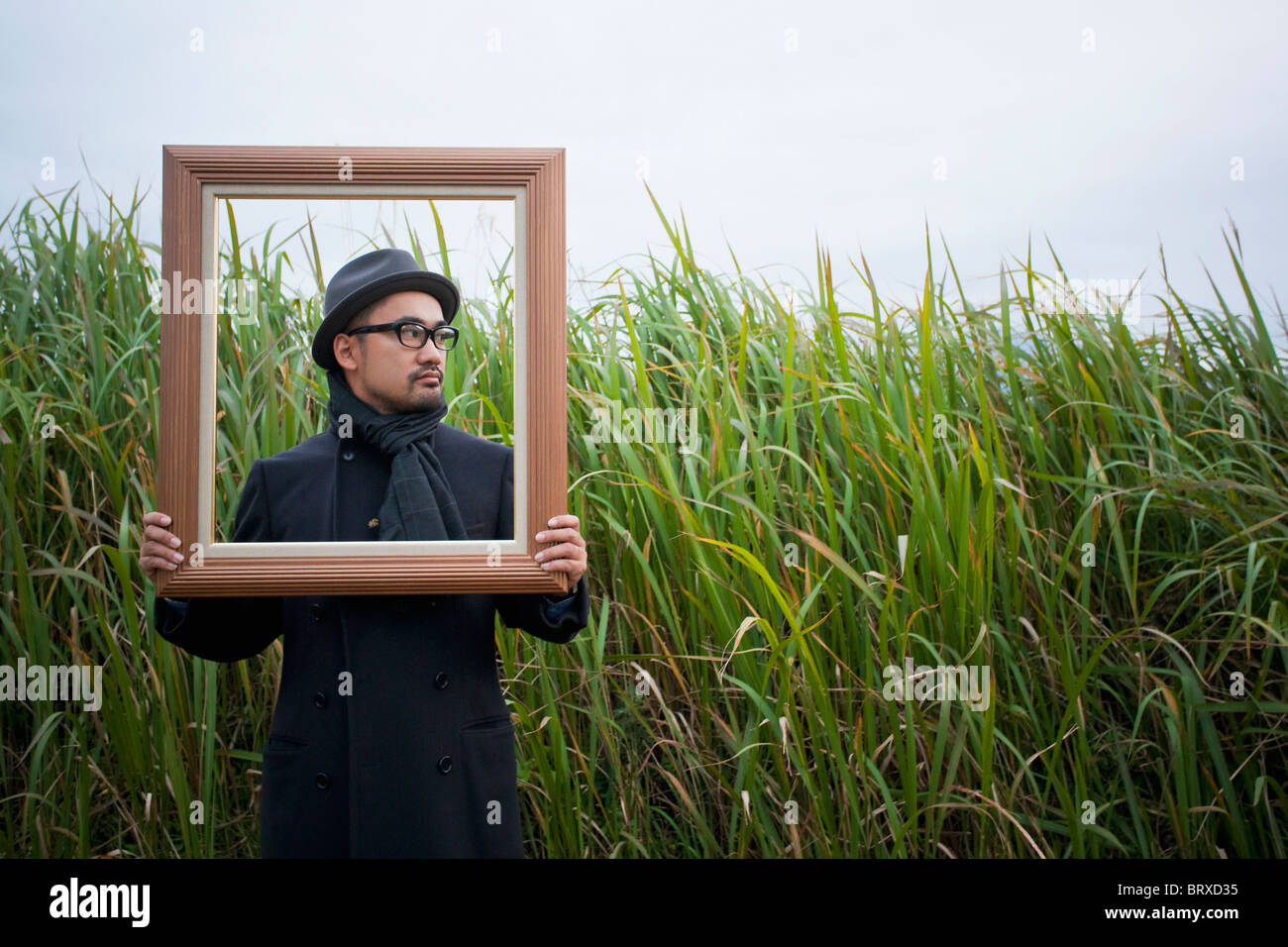 Mature Man Holding Picture Frame Stock Photo - Alamy