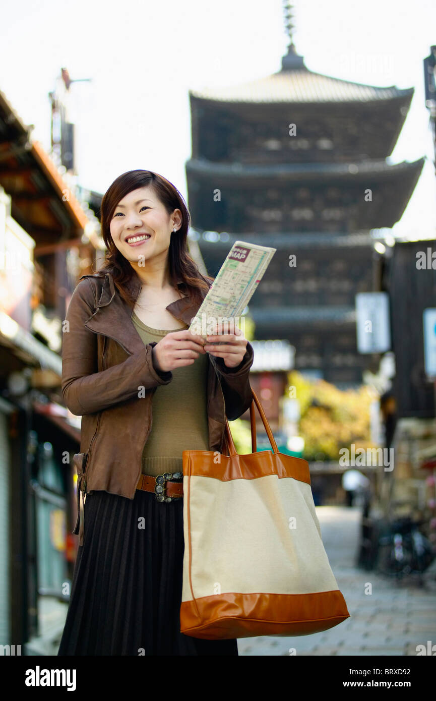 Young Woman Sightseeing in City Stock Photo - Alamy