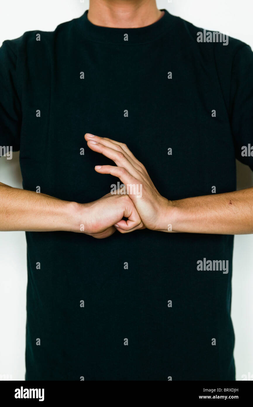 Close up of Young Man Holding Fist to His Hand Stock Photo - Alamy