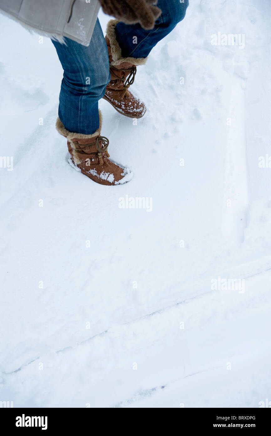 High Angle View of Young Woman in Snow Low Section Stock Photo - Alamy