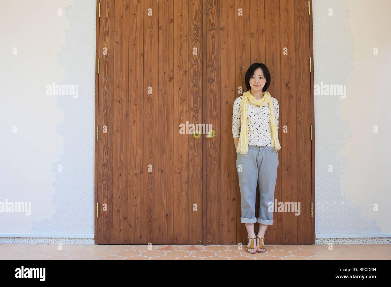 Woman lean on door hi-res stock photography and images - Alamy