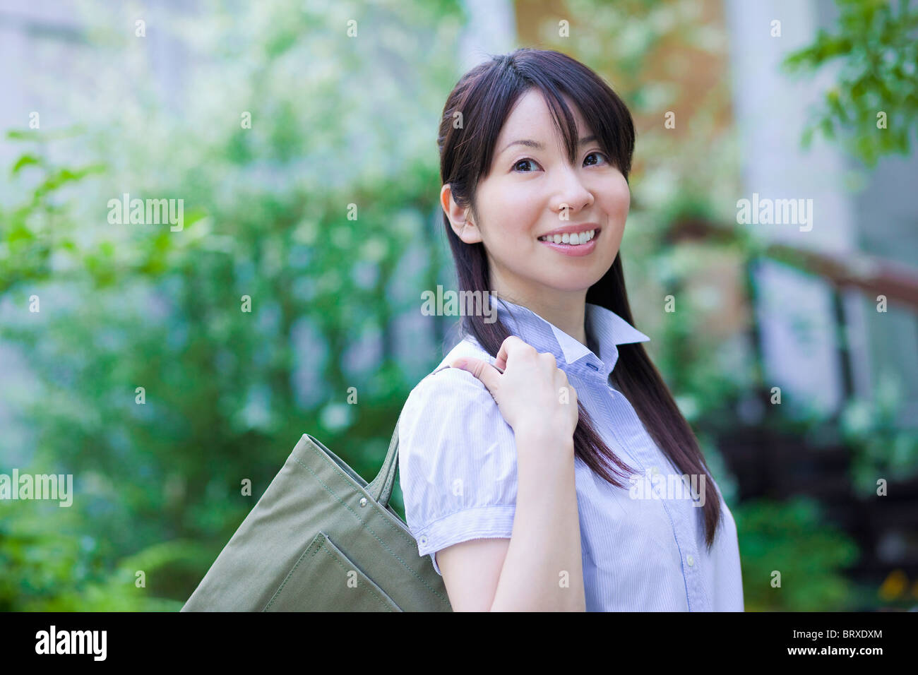 Young Woman Carrying Handbag Stock Photo - Alamy