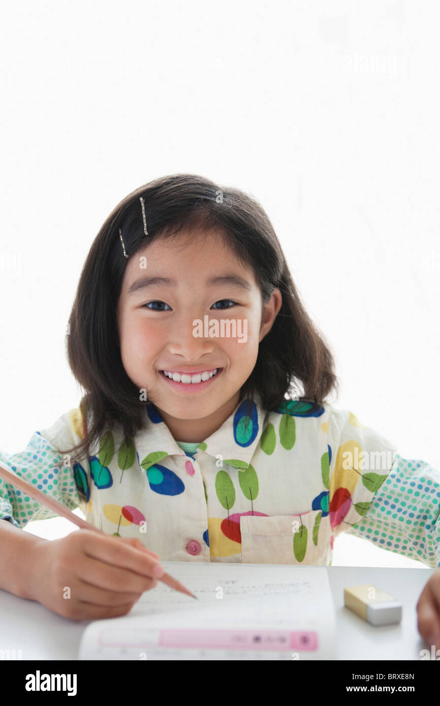 Young Girl Doing Homework Stock Photo - Alamy