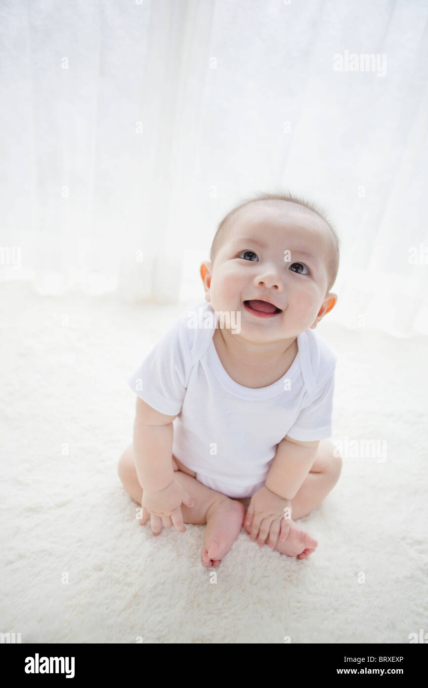 Happy Baby Boy Looking up Stock Photo - Alamy