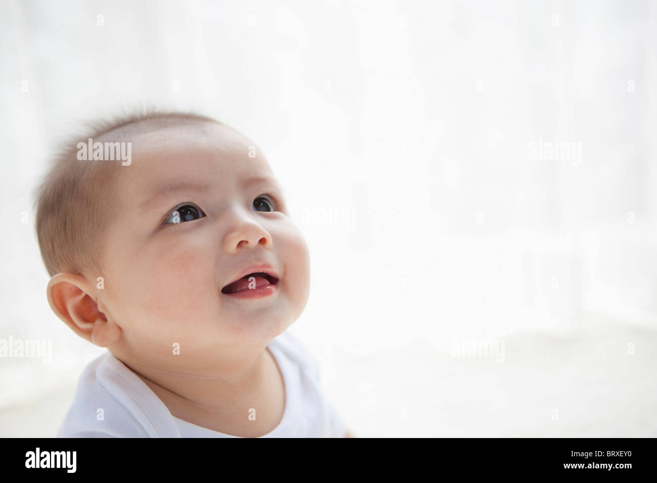 Baby Boy Looking up Stock Photo - Alamy