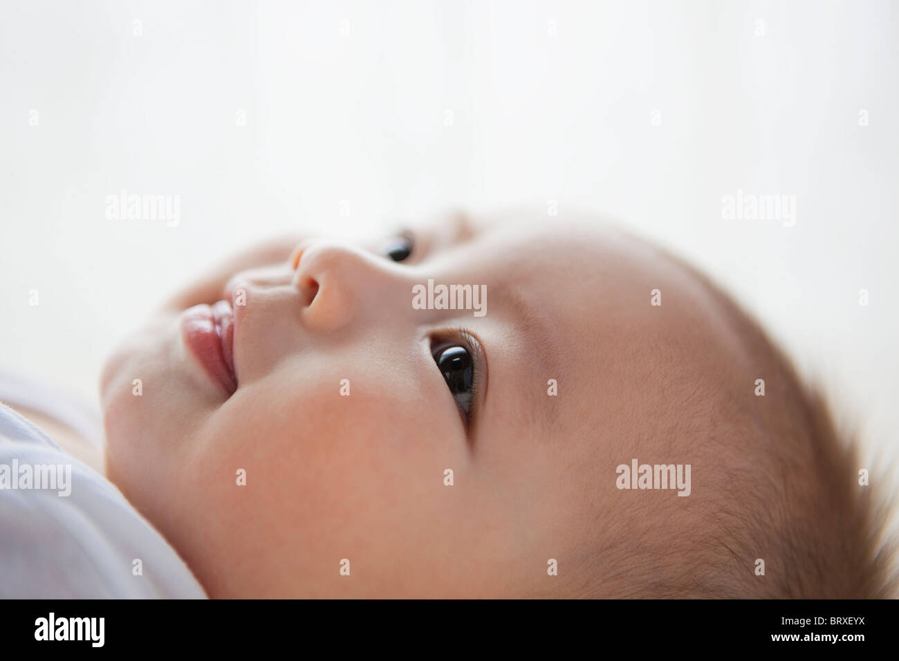 Close up of Baby Boy Looking up Stock Photo - Alamy