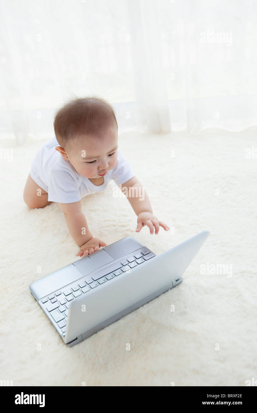 Baby Boy Using Laptop Computer Stock Photo - Alamy