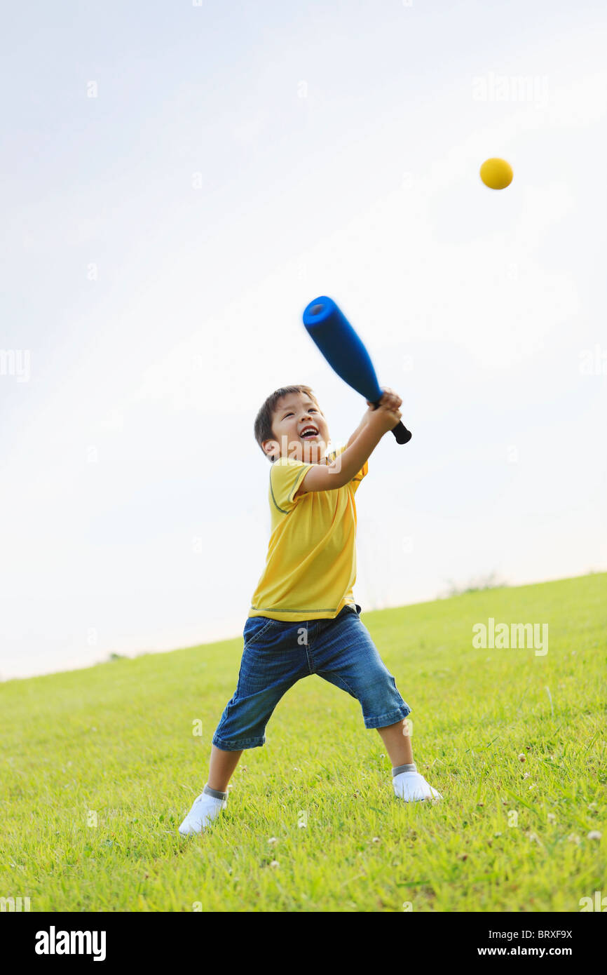 Boy Batting Ball Stock Photo - Alamy