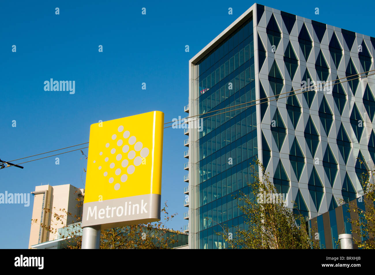 Metrolink sign and the Salford University 'Orange' building from the ...