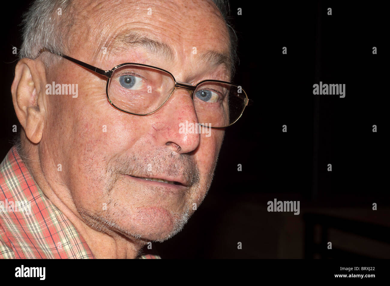 Portrait of an old mature senior citizen man with wrinkles and gray ...