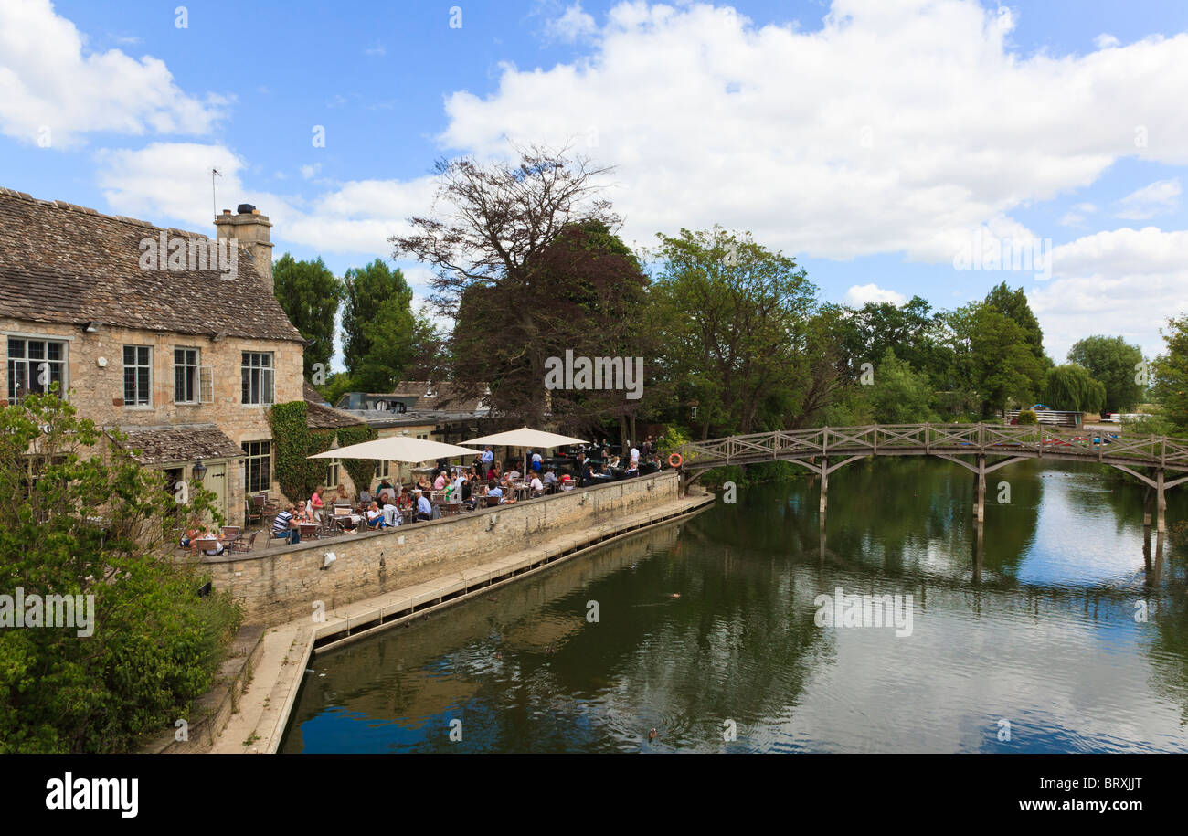 Diners and drinkers outside the Trout Inn on the banks of the River ...