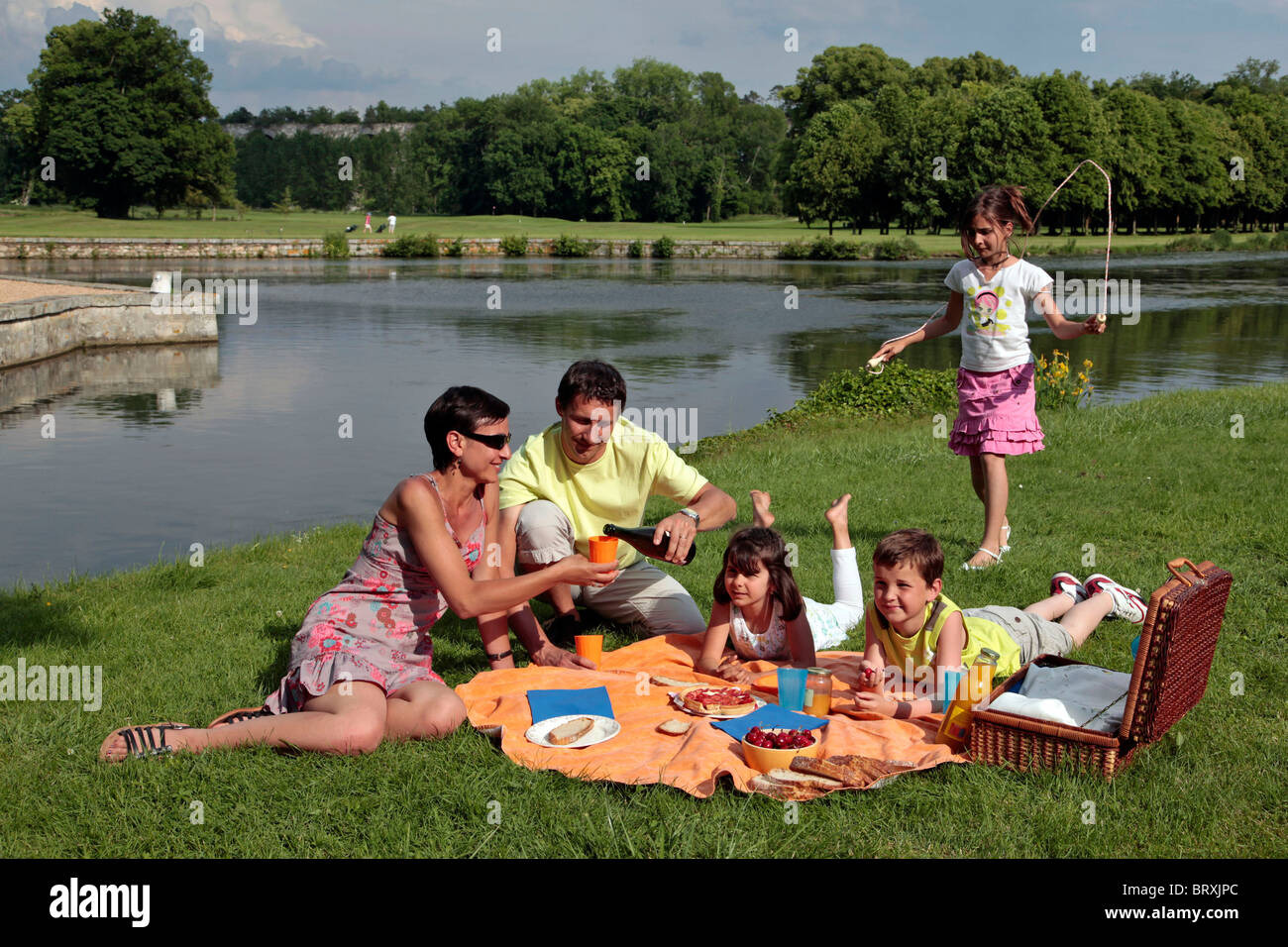 FAMILY PICNIC IN THE OPEN AIR IN THE PARK OF THE CHATEAU DE MAINTENON ...
