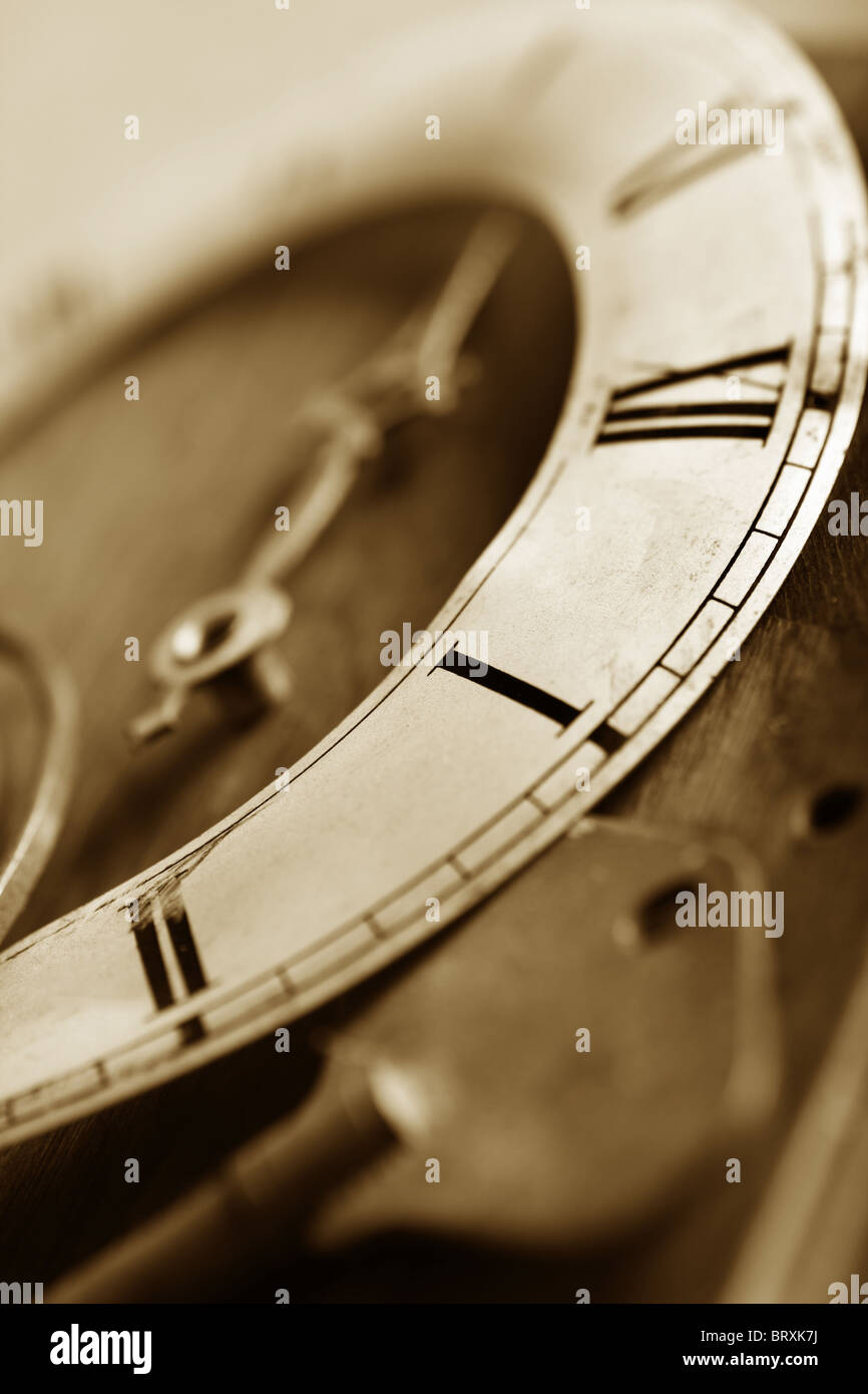 old worn clock, sepia toned Stock Photo - Alamy