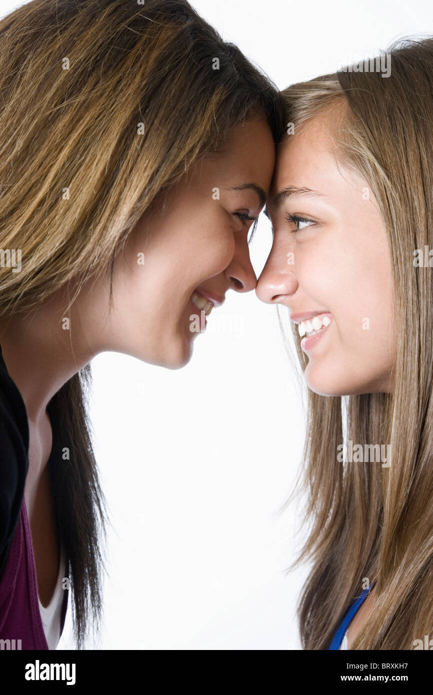 Two teenage girls face to face Stock Photo - Alamy