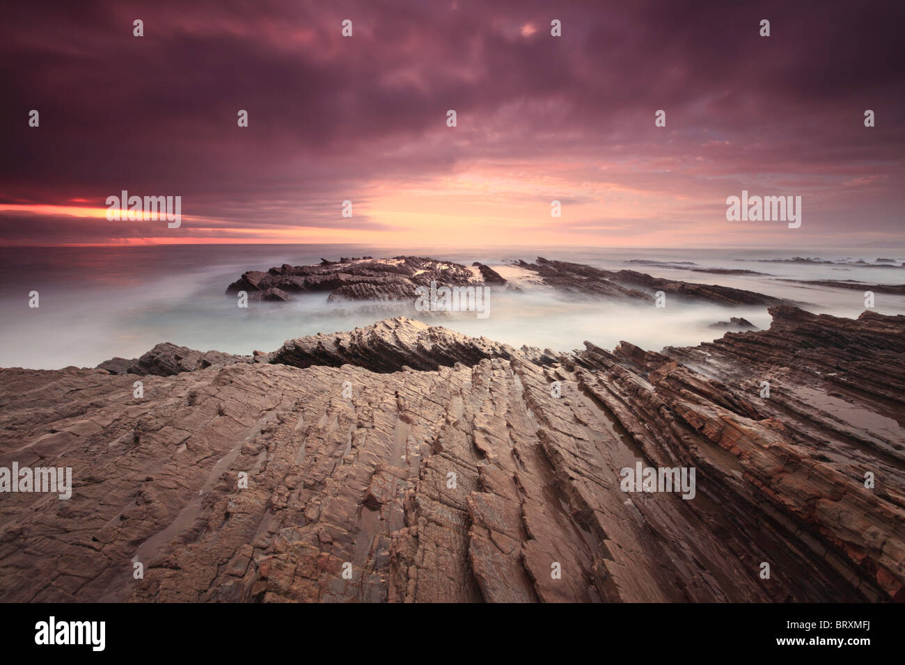Sunset colors over a rocky coastline (Big Sur, California Stock Photo ...