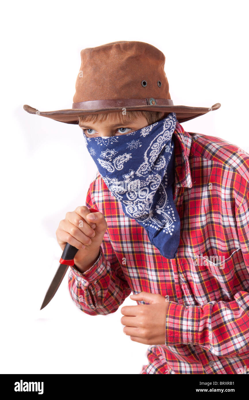 boy dressed up as bandit with knife on white Stock Photo - Alamy