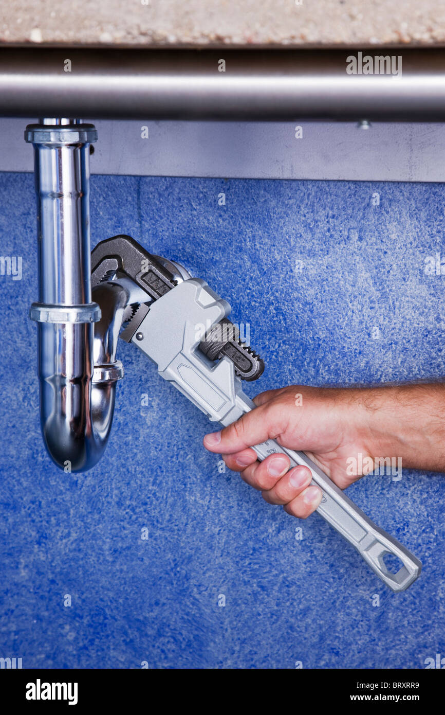 Hand holding pipe hi-res stock photography and images - Alamy