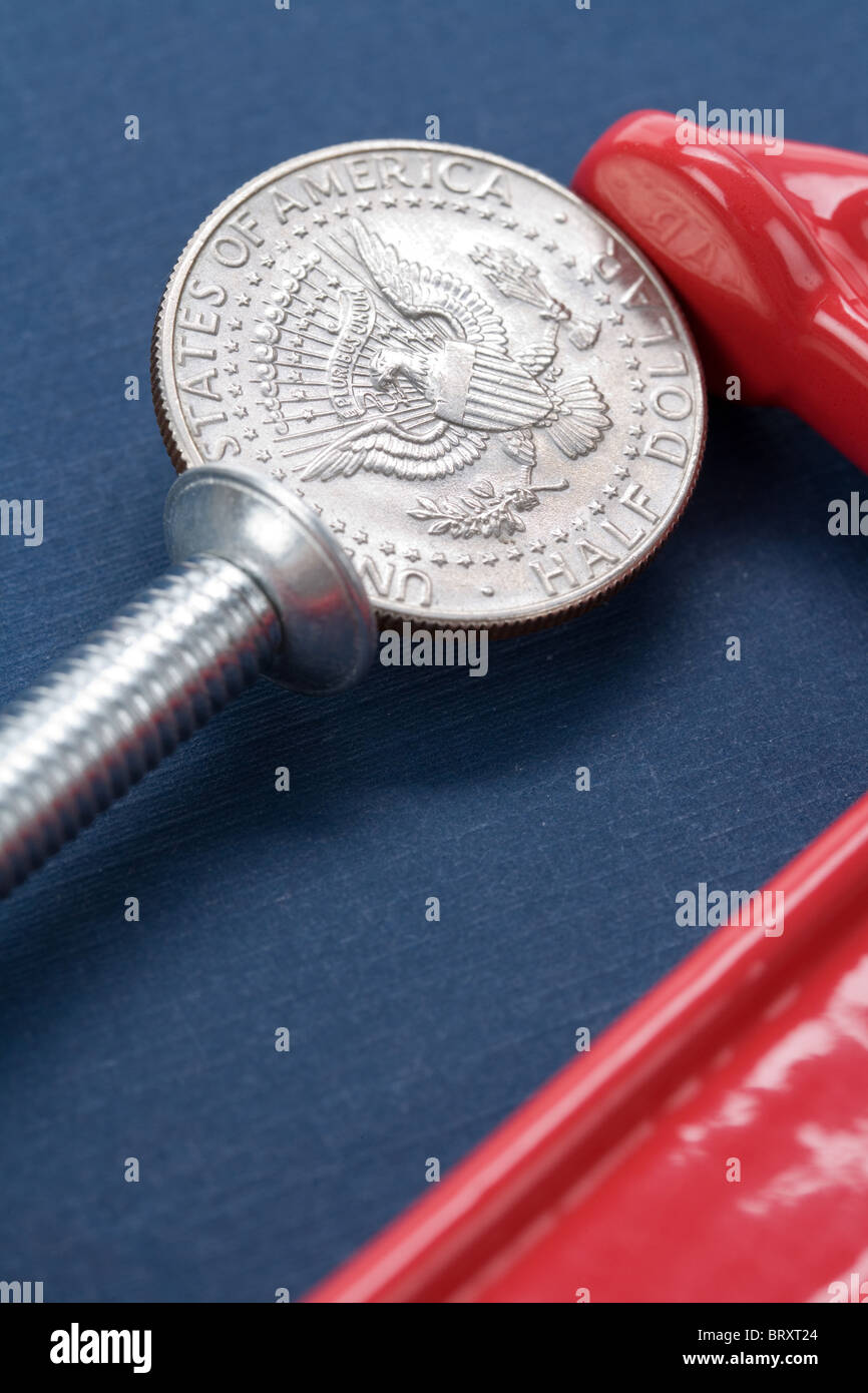 Vise Grip and coin close up Stock Photo - Alamy