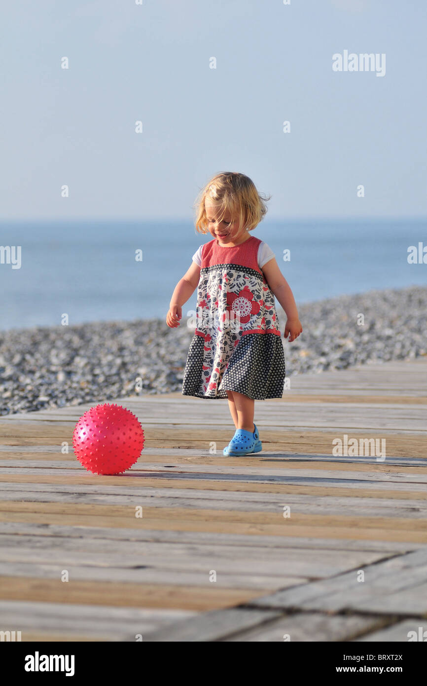 LITTLE GIRL PLAYING WITH A BALL, SOMME (80), PICARDY, FRANCE Stock ...