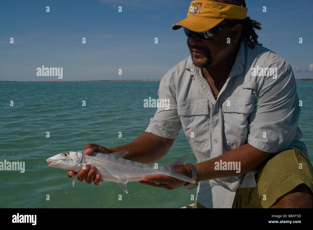 A guide lifts a healthy bonefish prior to release in the Turks & Caicos ...