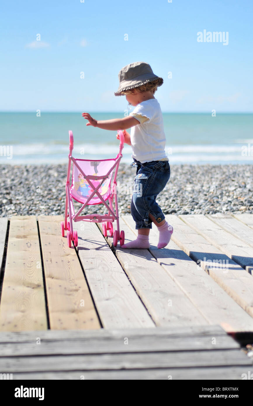 LITTLE GIRL PLAYING ON THE BOARDWALK, SOMME (80), PICARDY, FRANCE Stock ...