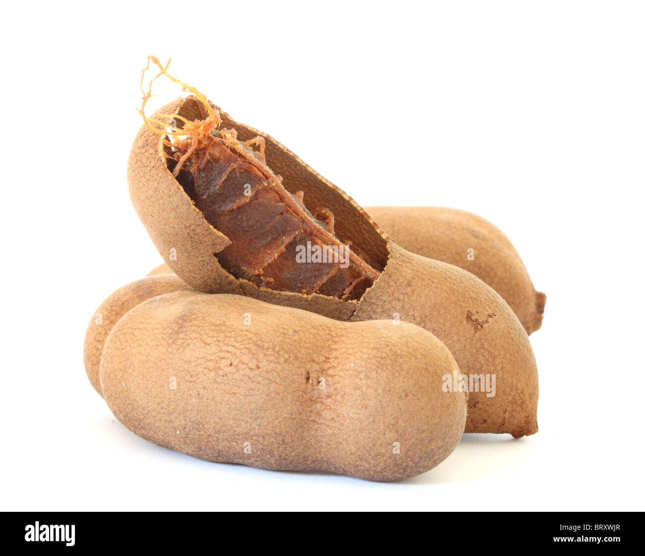 Ripe tamarind fruit on white background - whole and open pods close up ...