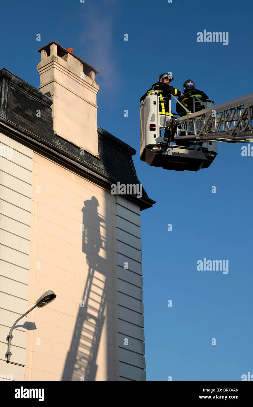 FIREFIGHTERS AT A CHIMNEY FIRE, YVETOT TOWN CENTER, SEINE-MARITIME (76 ...