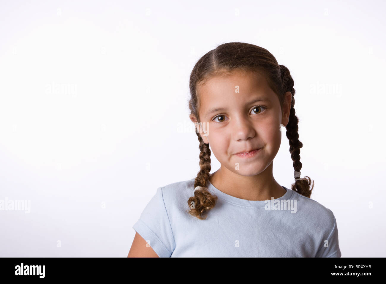 Studio portrait of girl (8-9 Stock Photo - Alamy