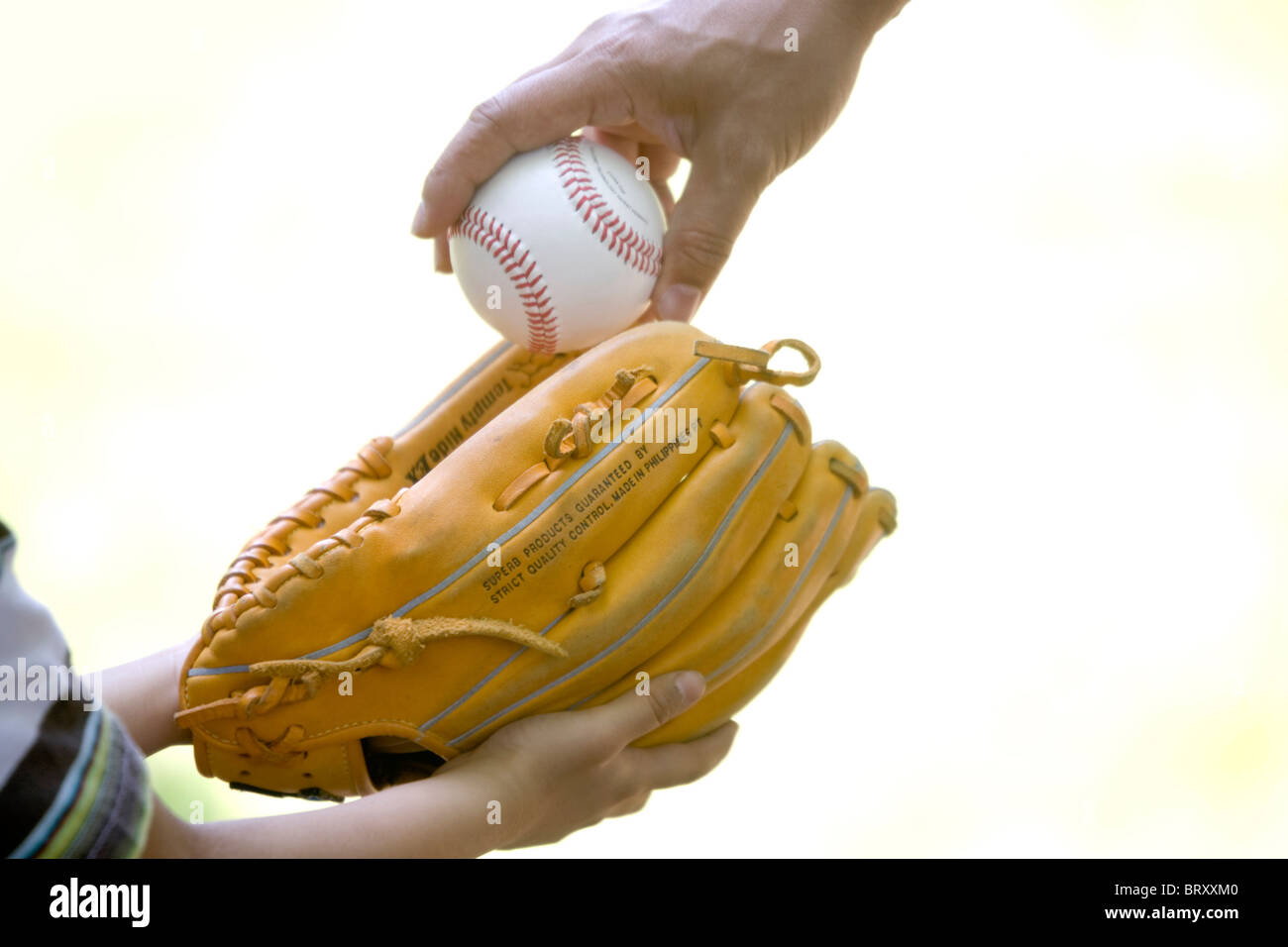 Son handing to father hi-res stock photography and images - Alamy