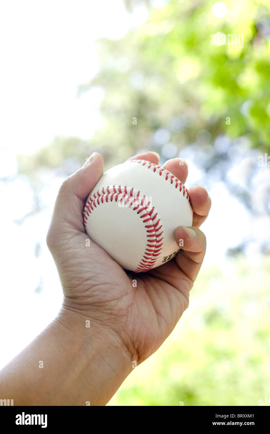 Hand holding baseball hi-res stock photography and images - Alamy