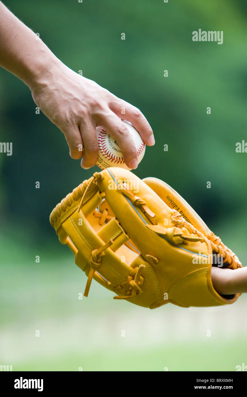 Son handing to father hi-res stock photography and images - Alamy