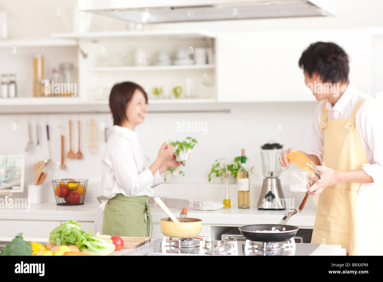 A couple cooking together Stock Photo - Alamy